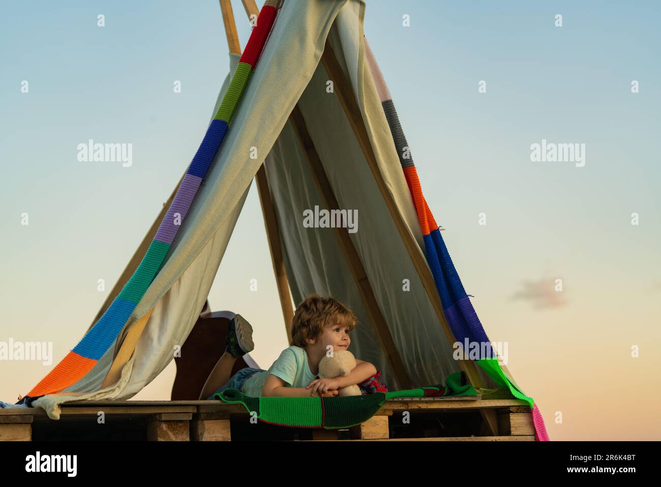 Camp dream. Kid dreams in tent outdoor. Childhood dream. Daydreamer ...