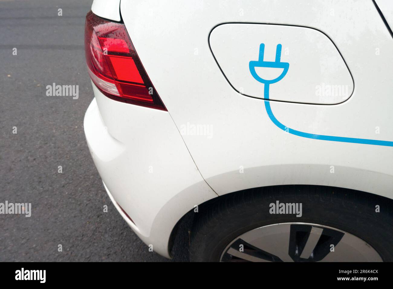 Electric plug symbol upon a car filling hatch Stock Photo - Alamy