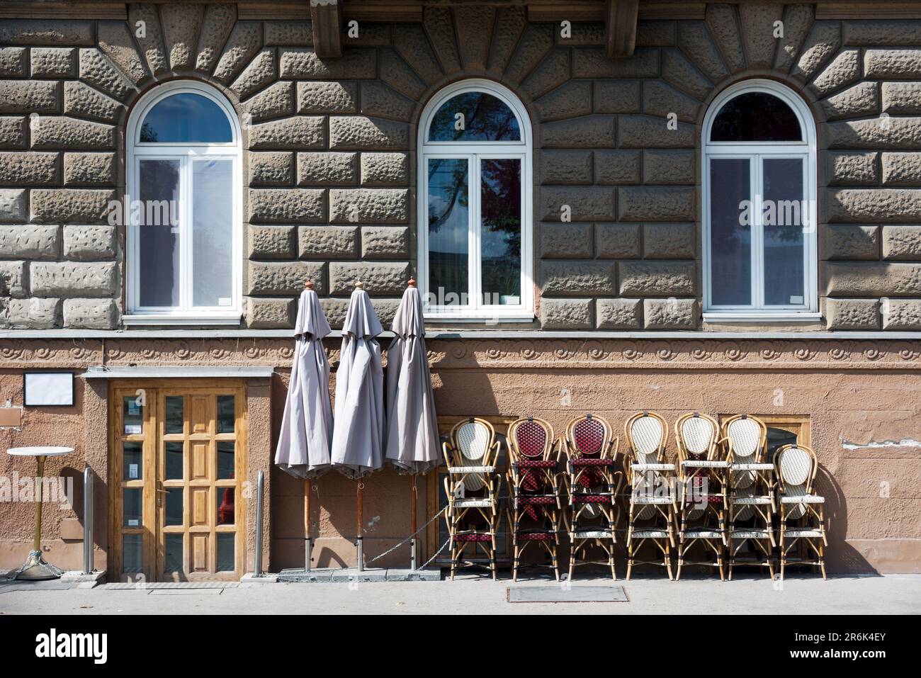 Stacked street cafe furniture Stock Photo - Alamy