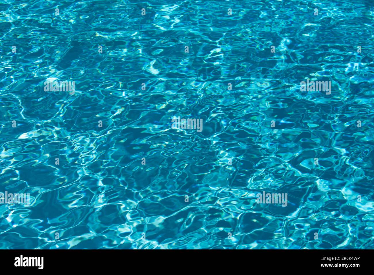 Ripple Water in swimming pool with sun reflection. Wavy water ...