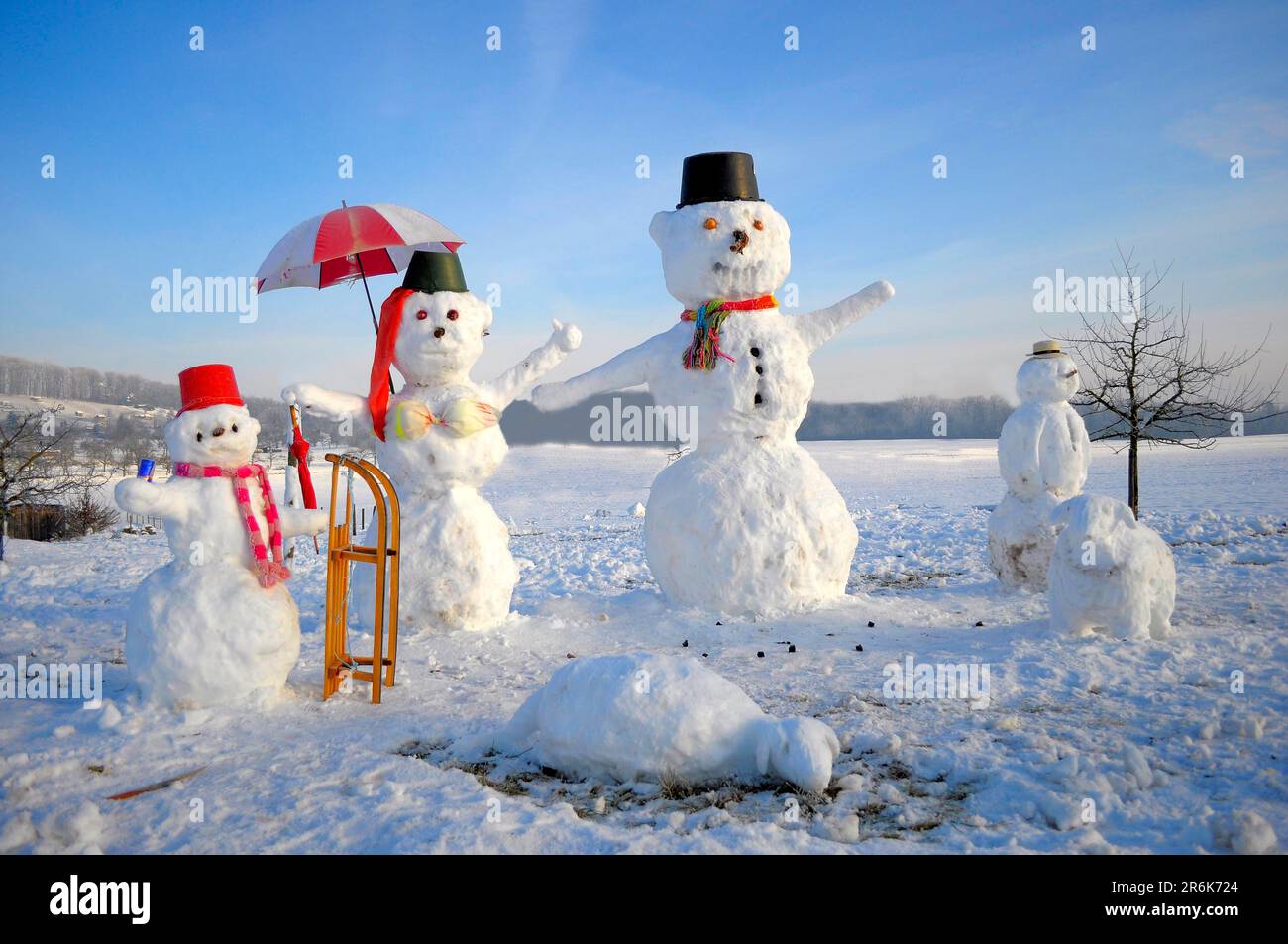 Snowman Family with animal figures, winter landscape Snowman Family ...