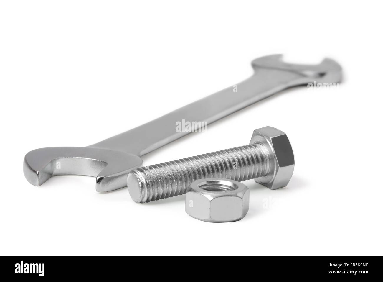 Chrome spanner, nuts and bolts on a white background Stock Photo - Alamy