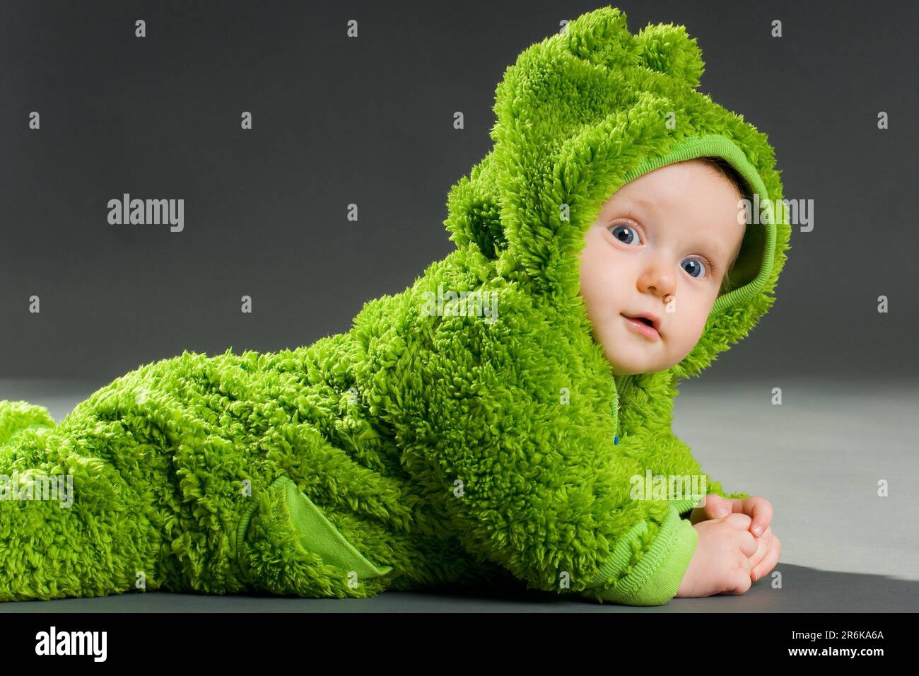 A cute cute baby in a furry frog costume Stock Photo - Alamy