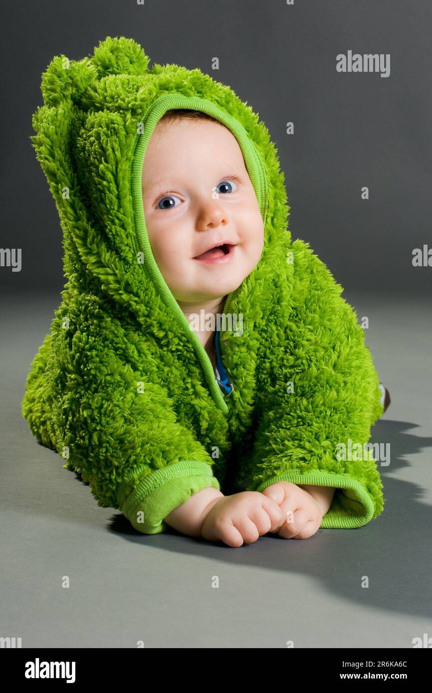 A cute cute baby in a furry frog costume Stock Photo - Alamy
