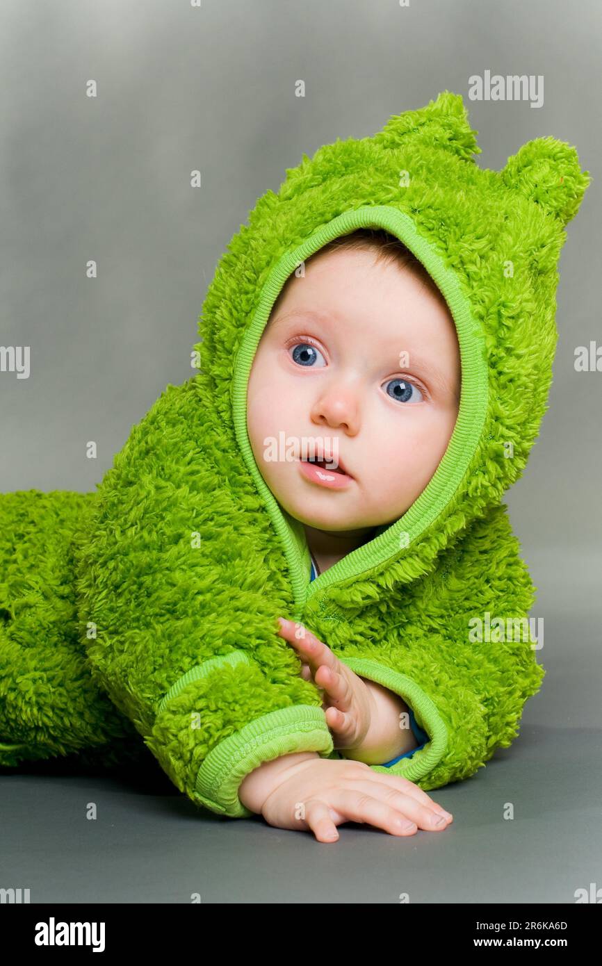 A cute cute baby in a furry frog costume Stock Photo - Alamy