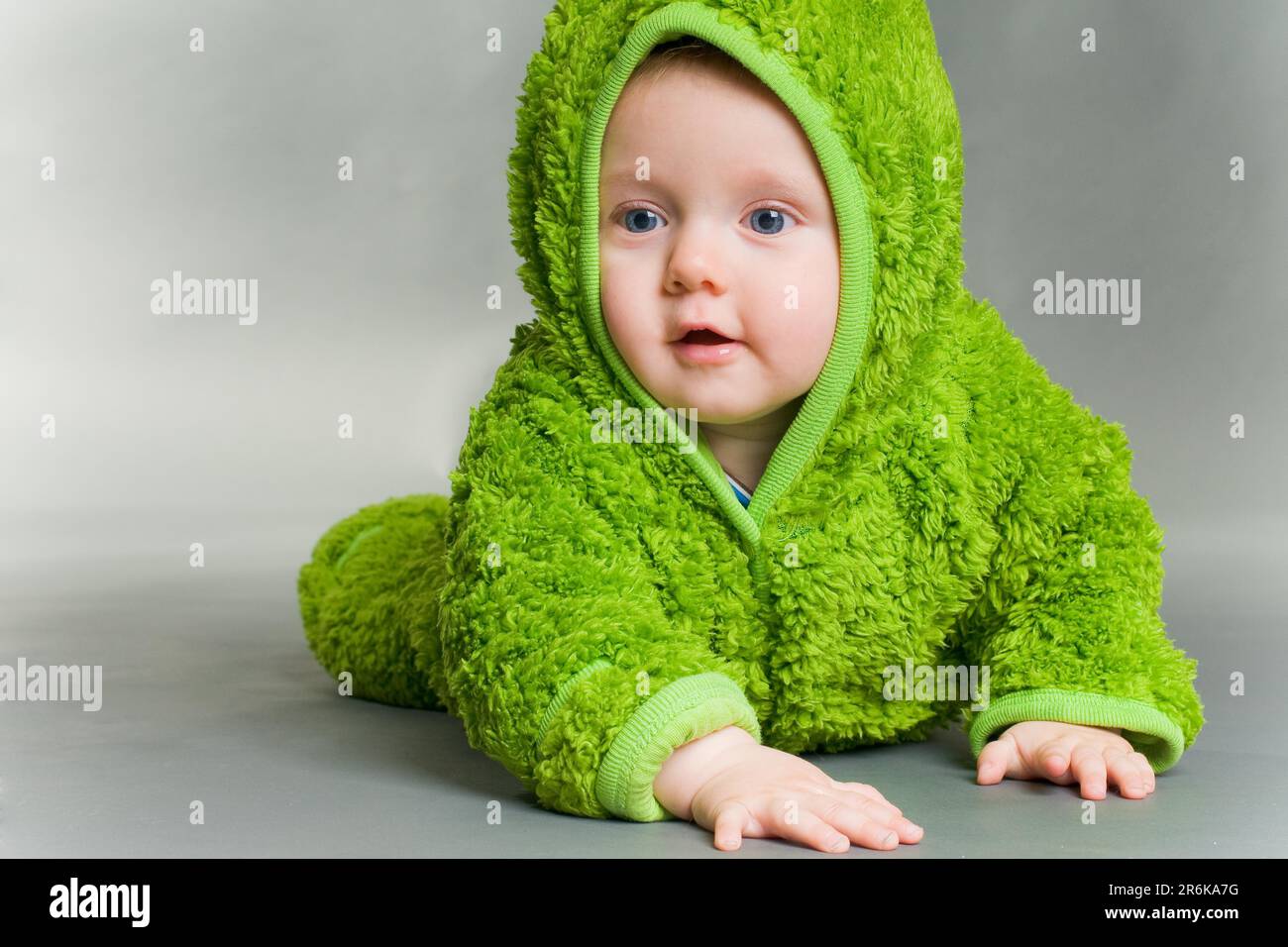 A cute cute baby in a furry frog costume Stock Photo - Alamy