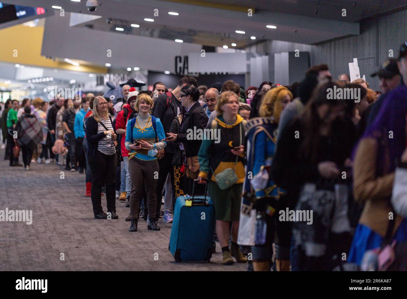 Fans and cosplayers seen at the ticket line during the OzComicCon 2023 ...