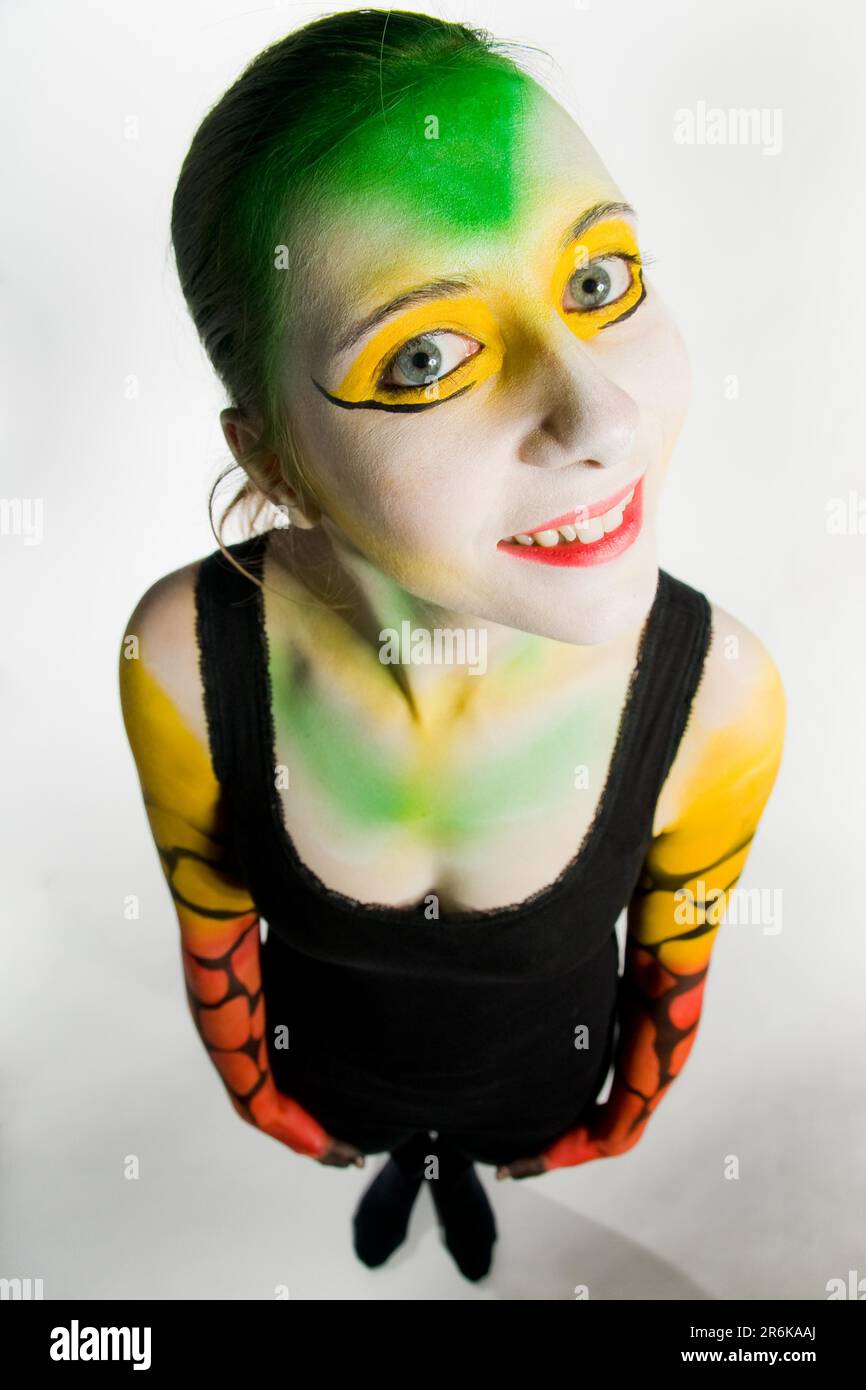 Colourful painted woman from above from wide angle perspective with big ...