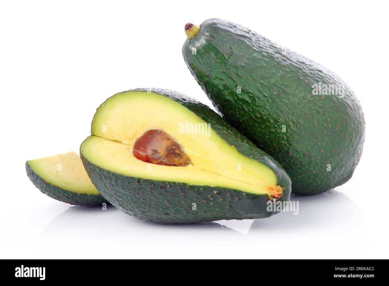 Ripe sliced avocado fruits isolated on white background Stock Photo - Alamy