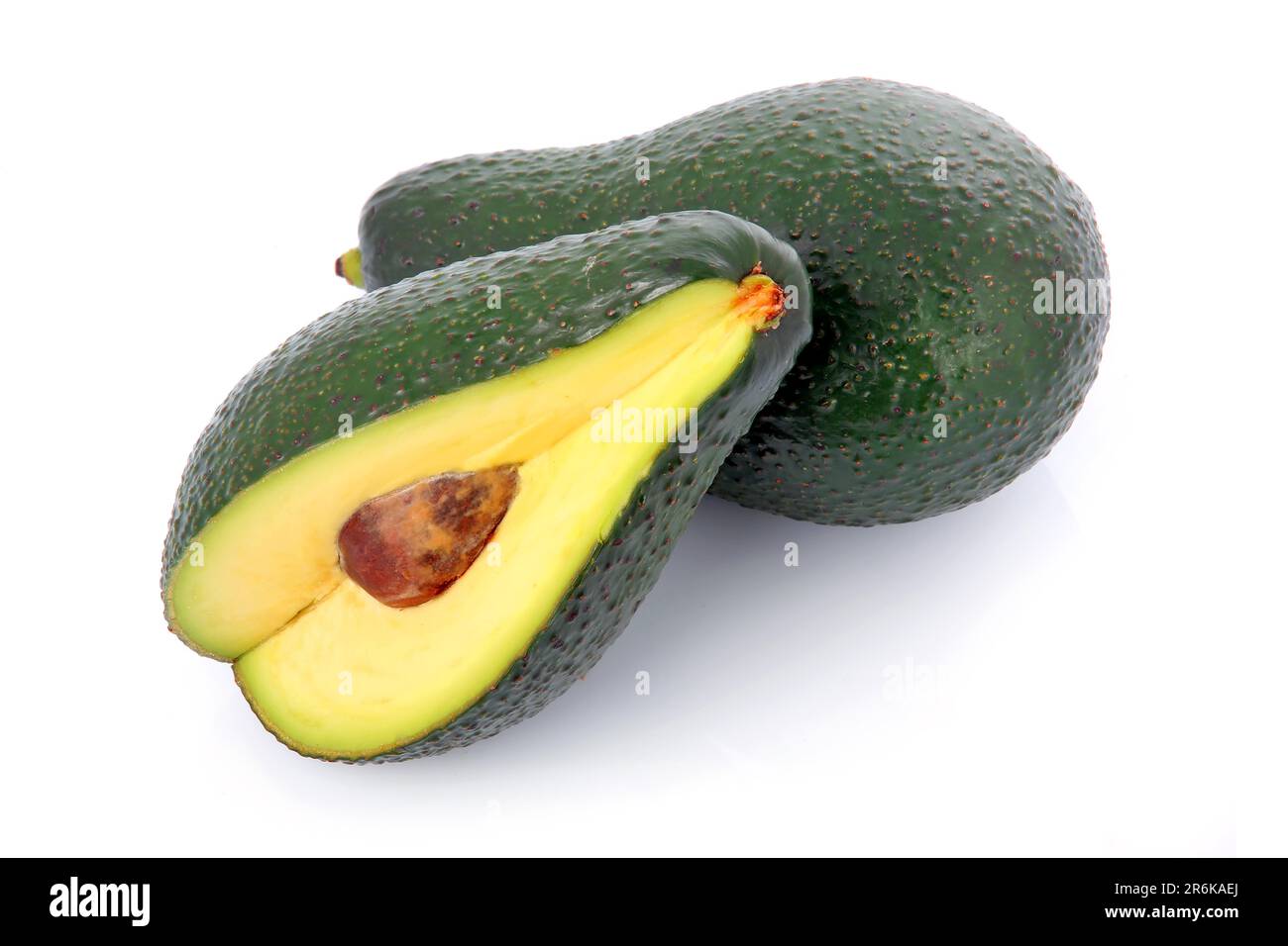 Ripe sliced avocado fruits isolated on white background Stock Photo - Alamy