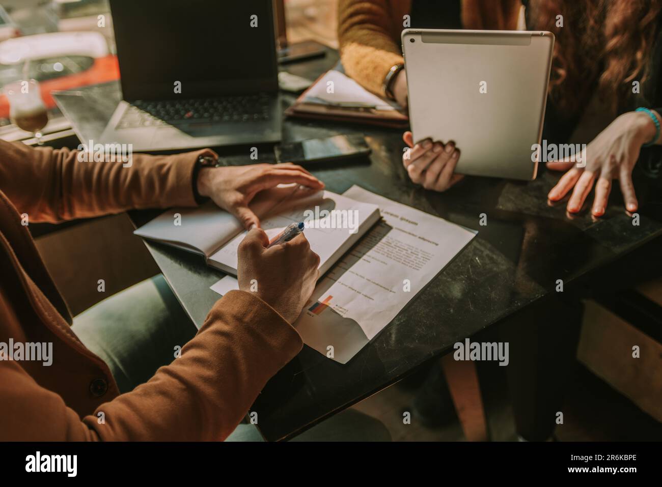 A close up photo of white male business person calculating and drawing ...