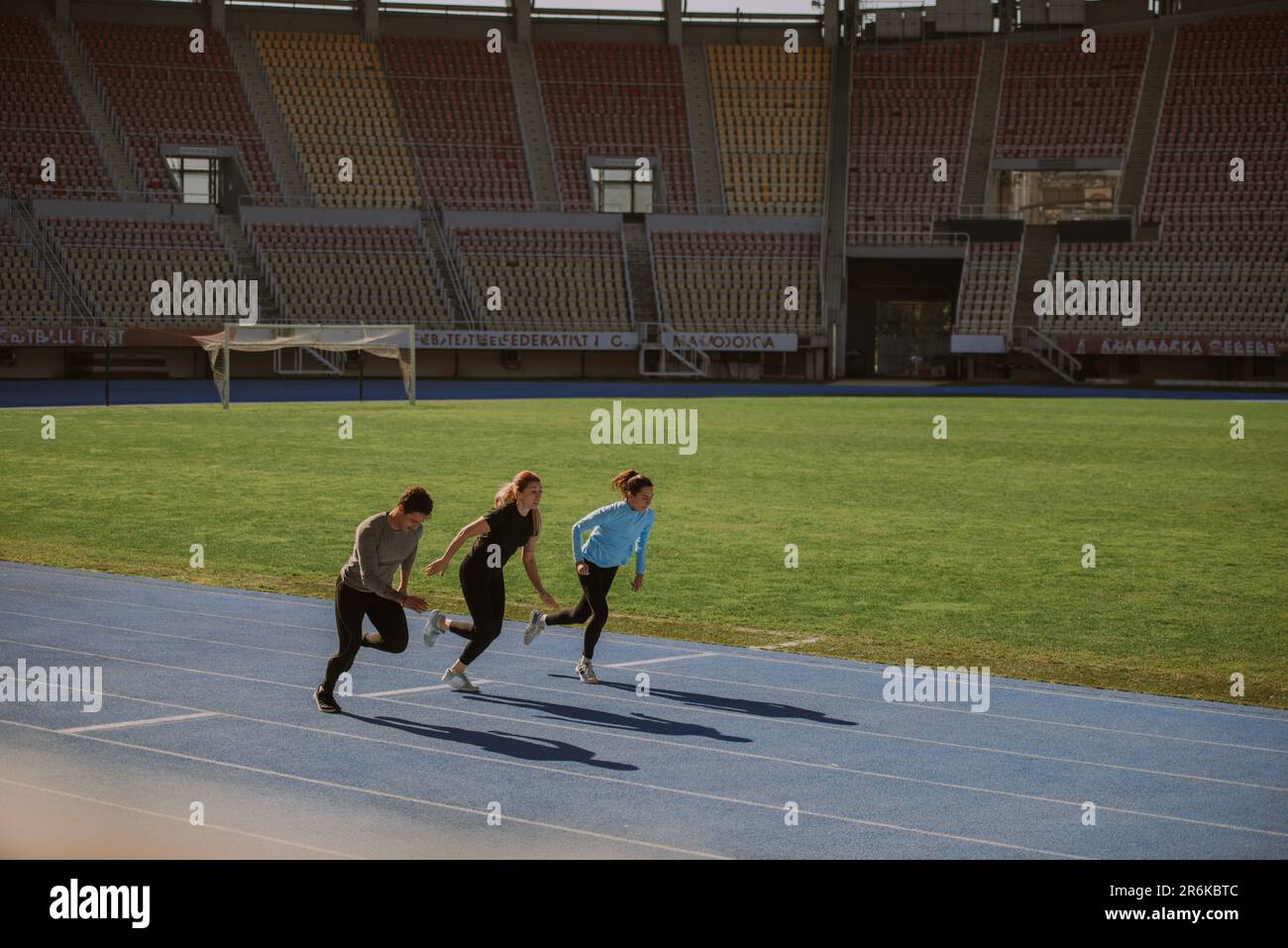 Three friends warming up together hi-res stock photography and images ...
