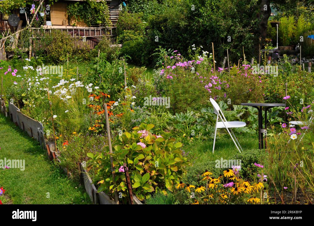 Farm garden with garden house, various perennials Stock Photo - Alamy
