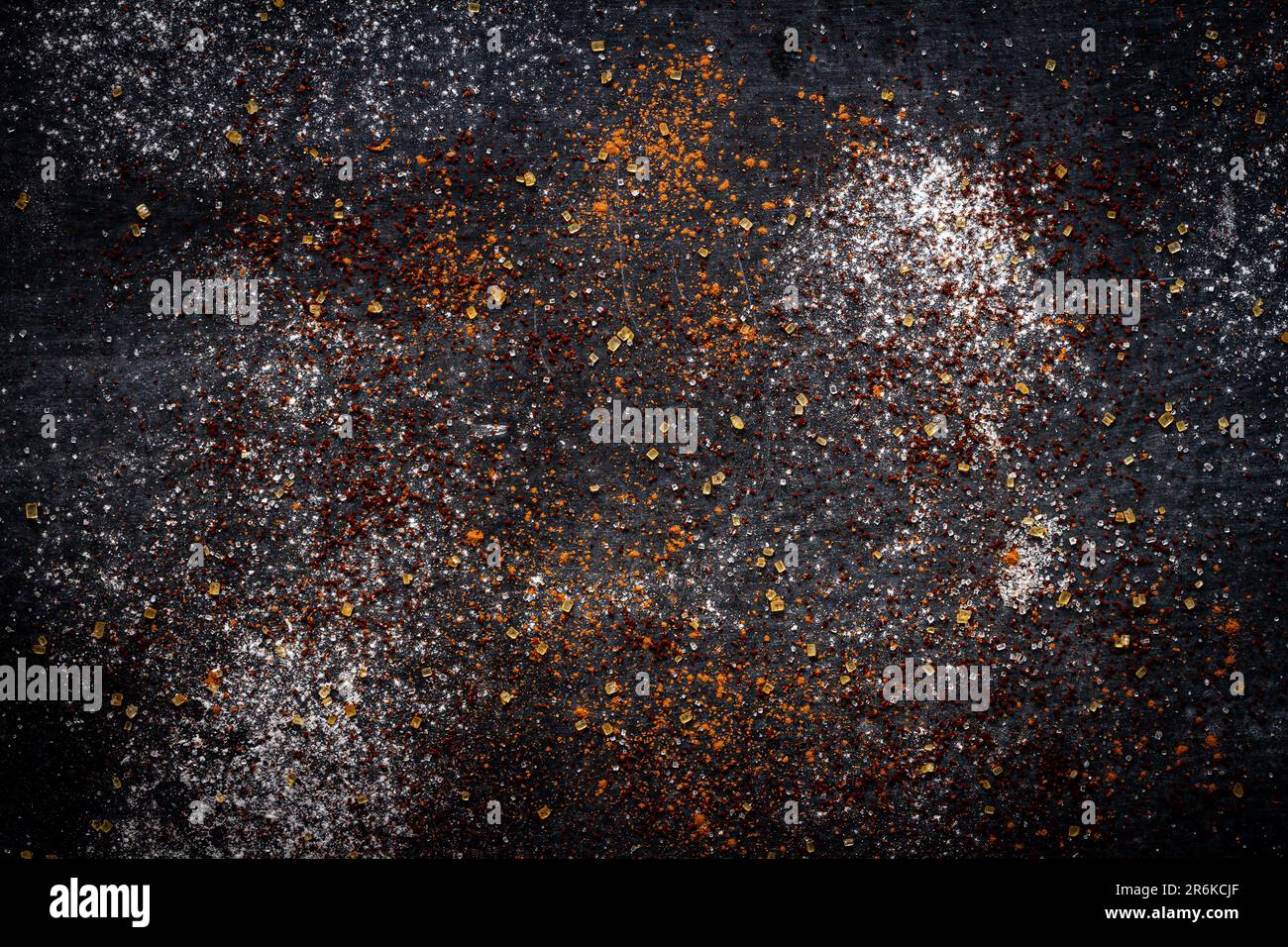 Sprinkled brown and white sugar, coffee, cocoa powder on black ...