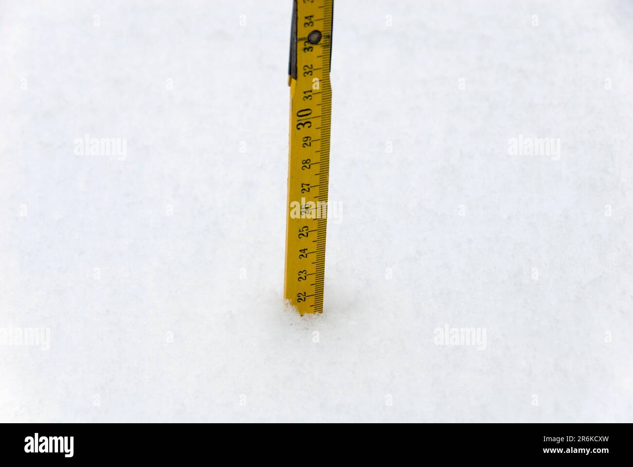Folding rule in the snow, measuring snow height, Peine districts, Lower ...