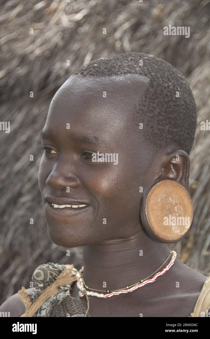 Surma woman with earlobe plate, ear jewellery, ear plate, Kibish, Omo ...