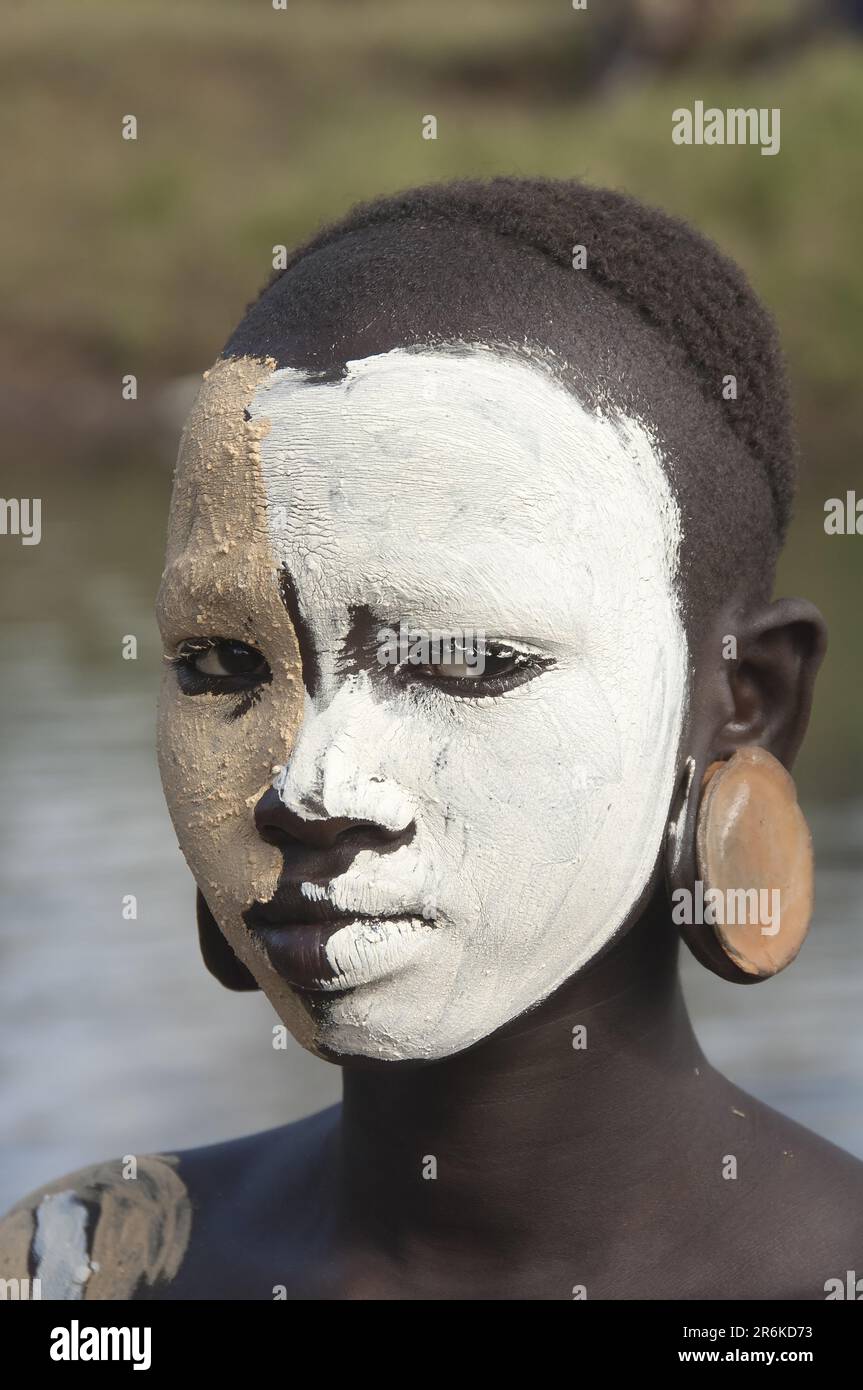Surma girl with body painting and earlobe plate, ear plate, Kibish, Omo ...