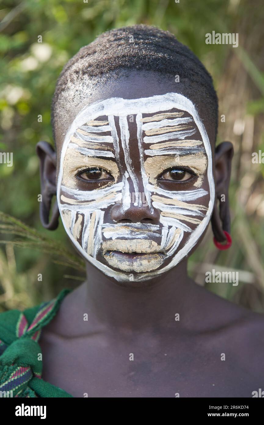 Surma girl with face painting and earlobes pulled out, Kibish, Omo ...