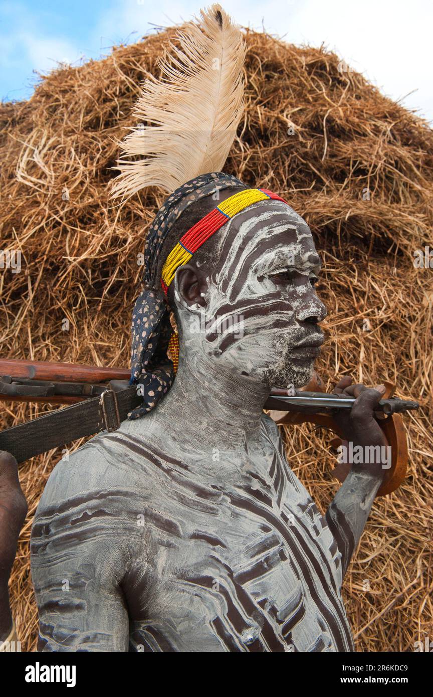 Karo warrior with body painting and rifle, Omo Valley, Southern ...