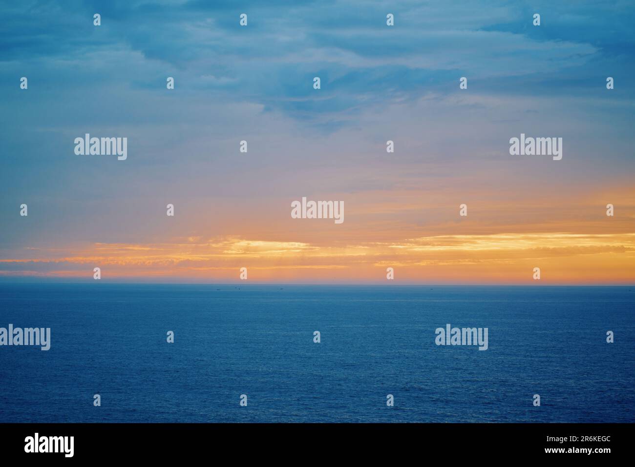 Waves rock beach sea sky water sun sunset hi-res stock photography and ...