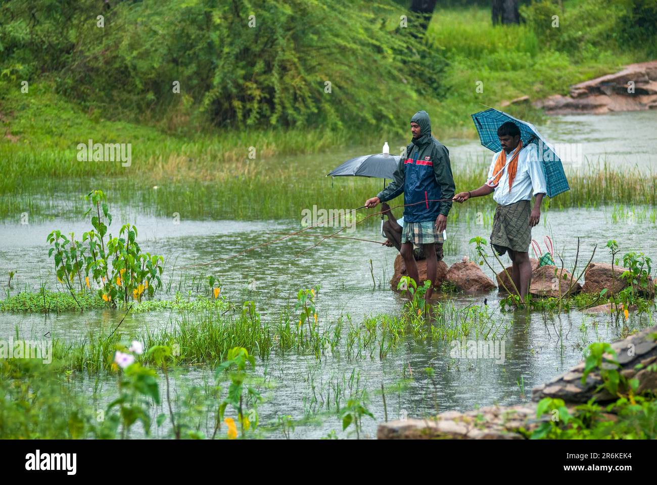 Village people angling during a rainy day, Tamil Nadu, South India ...