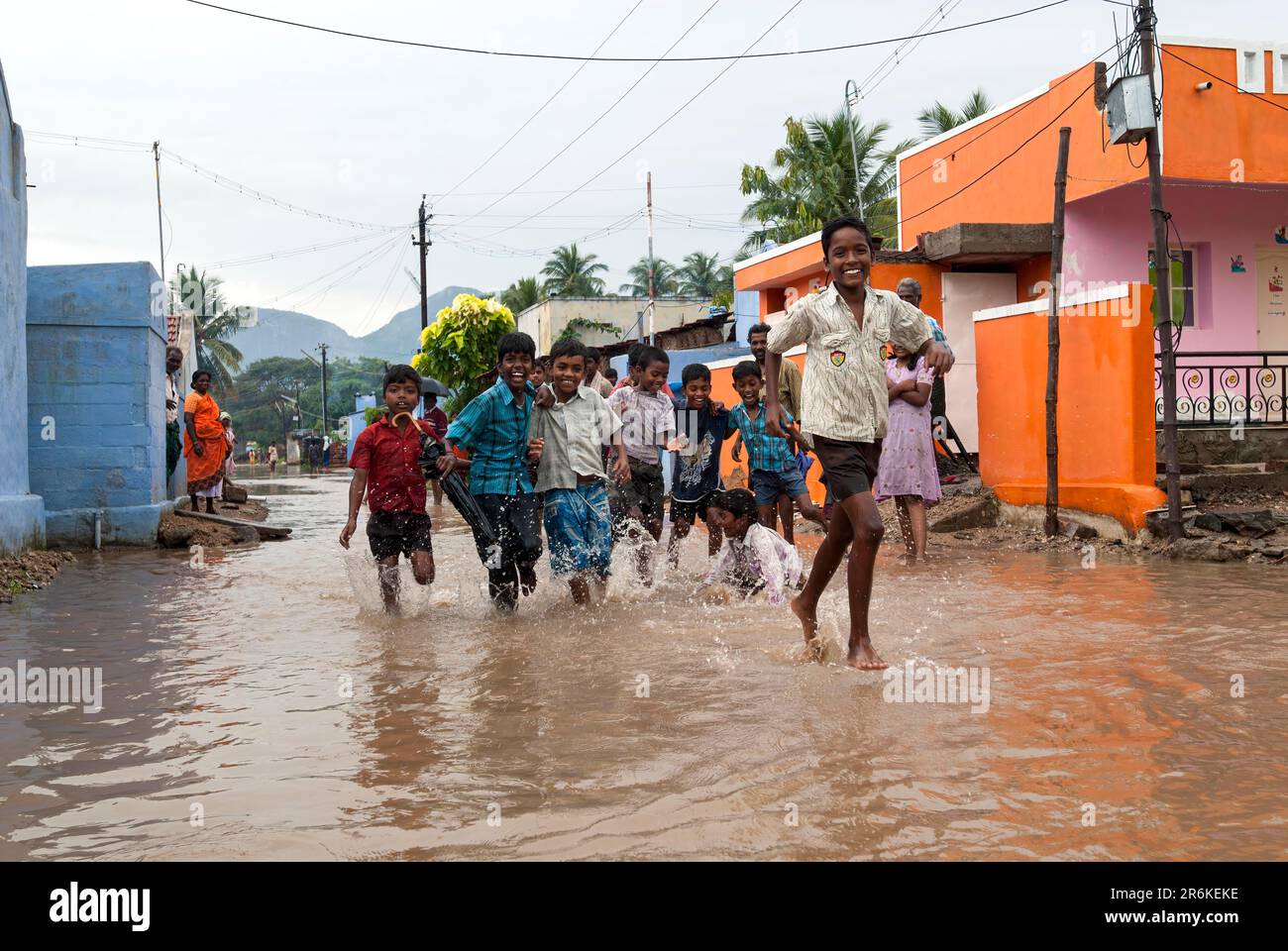 Village children playing in the rain water, Tamil Nadu, South India ...