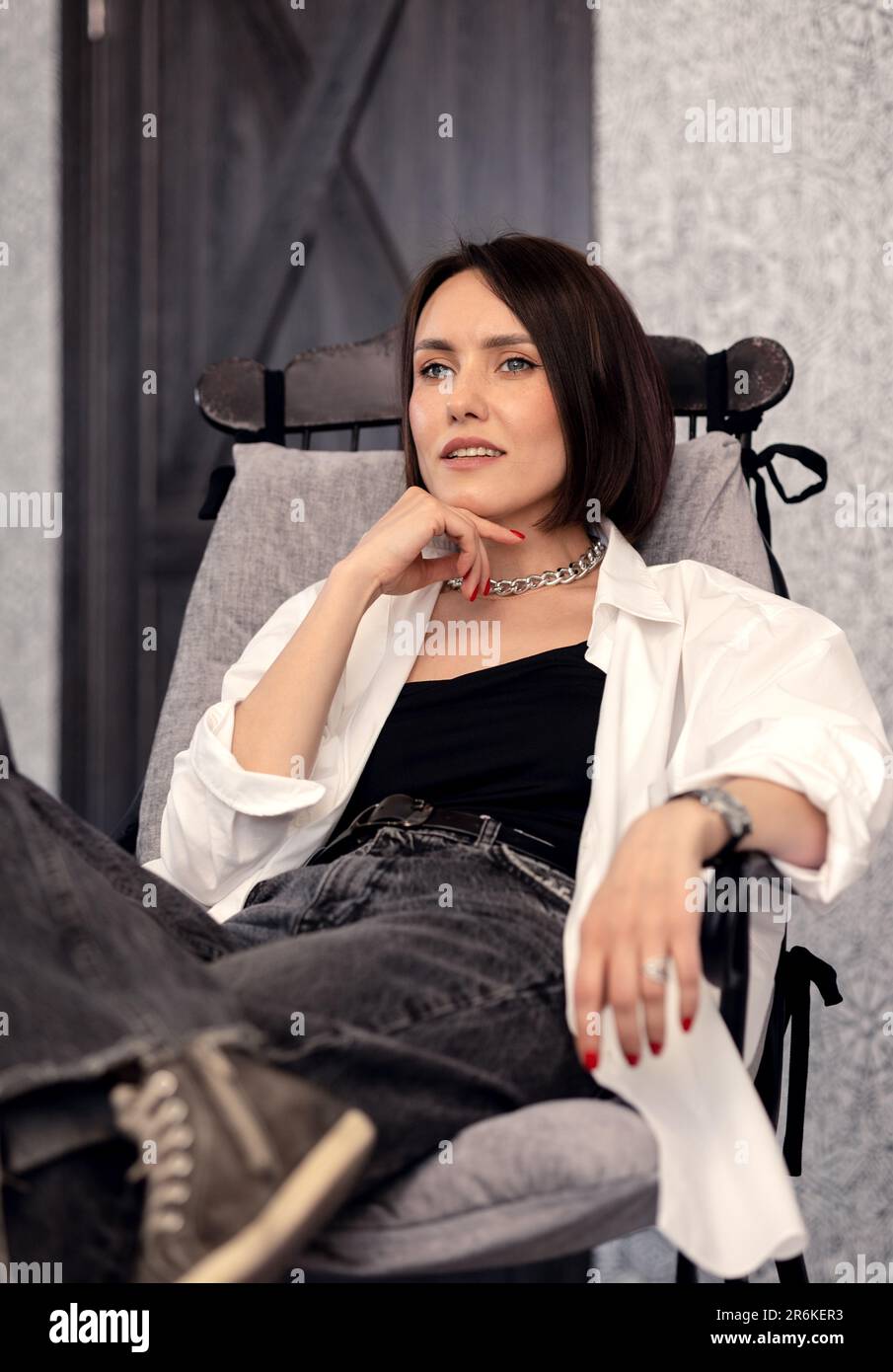 Armchair woman relaxing wall hi-res stock photography and images - Alamy