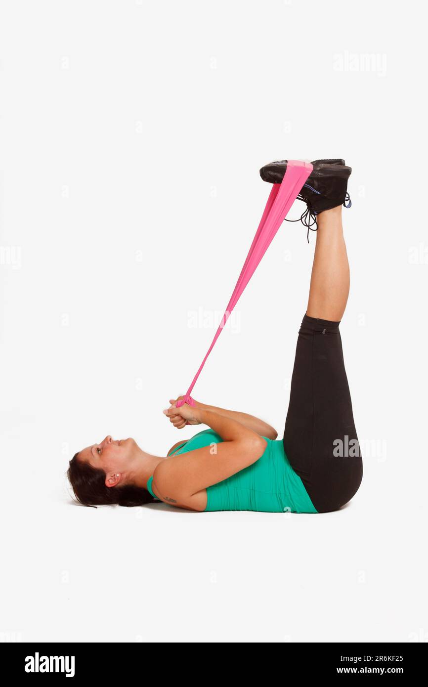 Woman, sport exercise with Thera-Band, sideways Stock Photo - Alamy