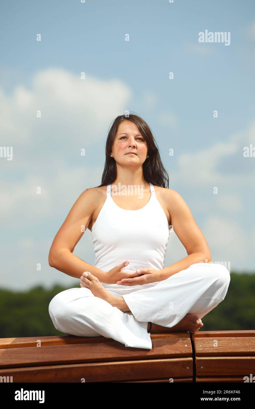 Yoga 'Half Lotus Pose', Yoga Exercise Stock Photo - Alamy