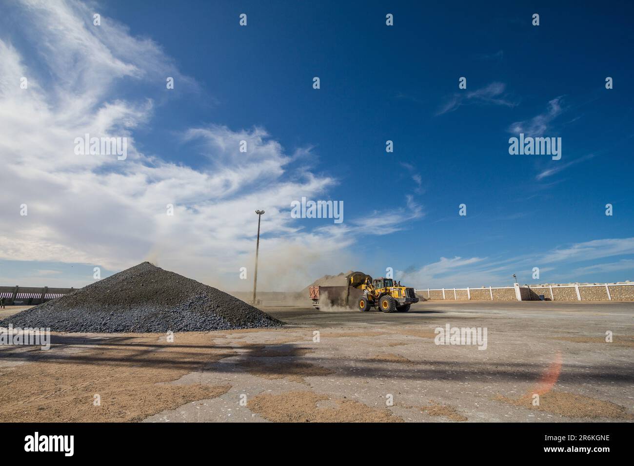 Dockside Operations: Loading Cement via Excavator at Laayoune Port ...