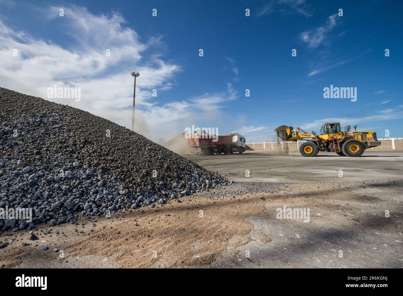 Quay Activity: Excavator Loading Cement into Truck at Laayoune Port ...