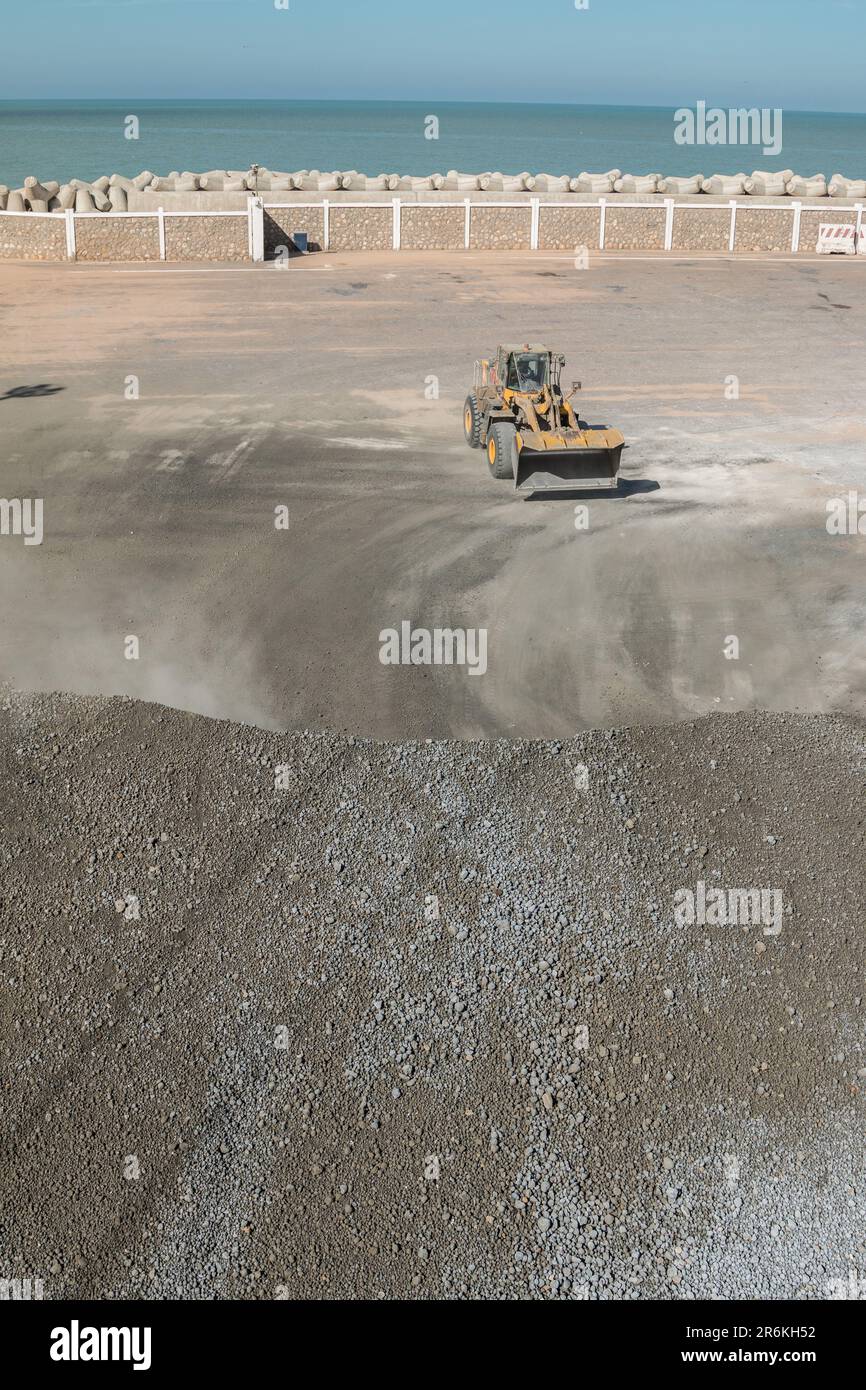 Excavator Loading Cement at Laayoune Port's Diverse and Bulk Quay Stock ...
