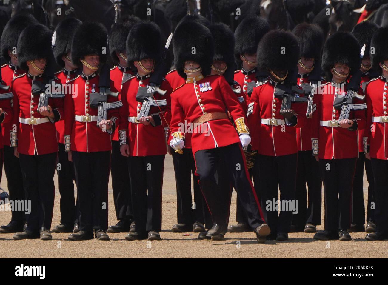 Image 2 of 8 in a sequence showing a member of the military fainting ...