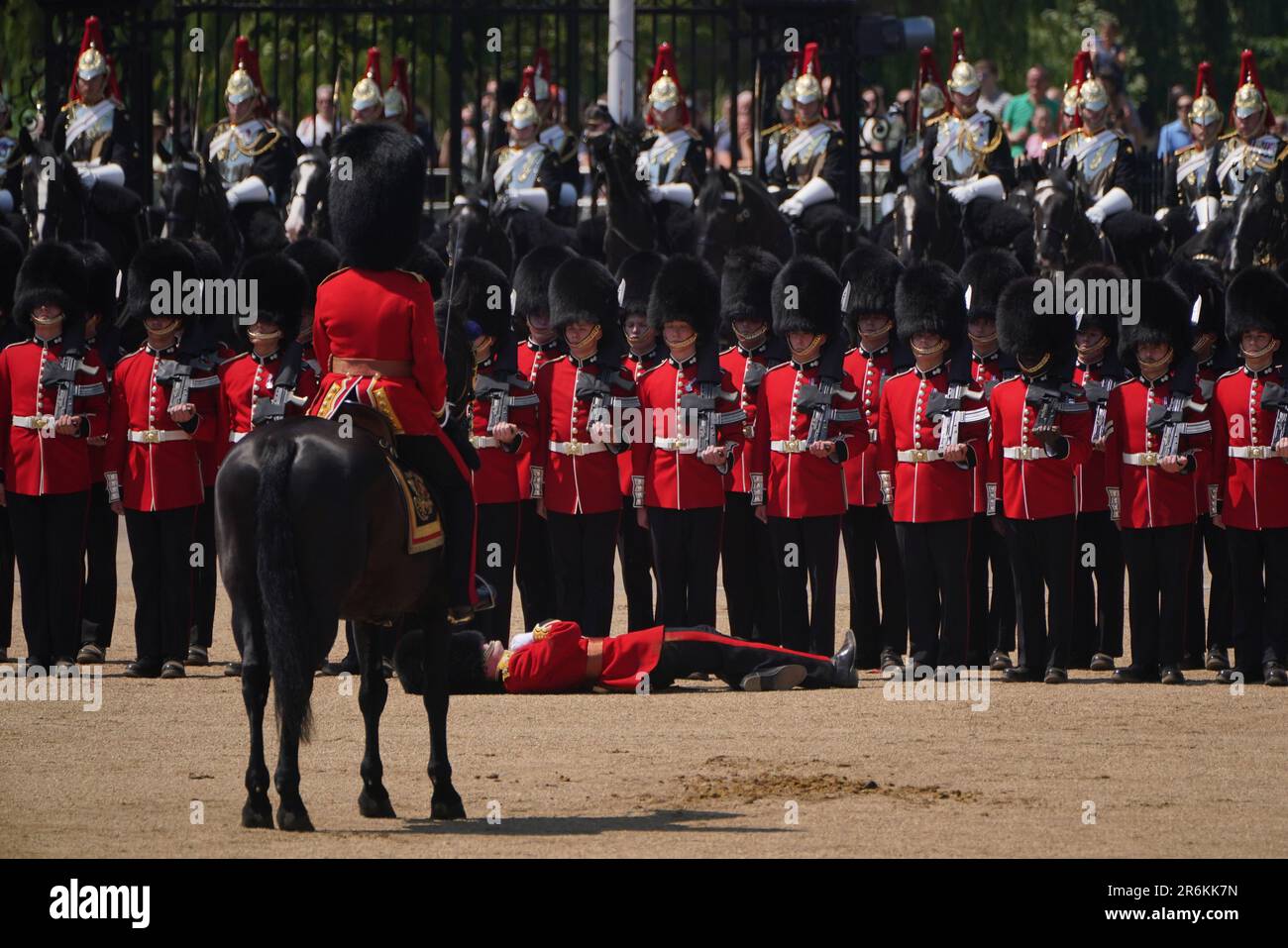 Image 8 of 8 in a sequence showing a member of the military fainting ...