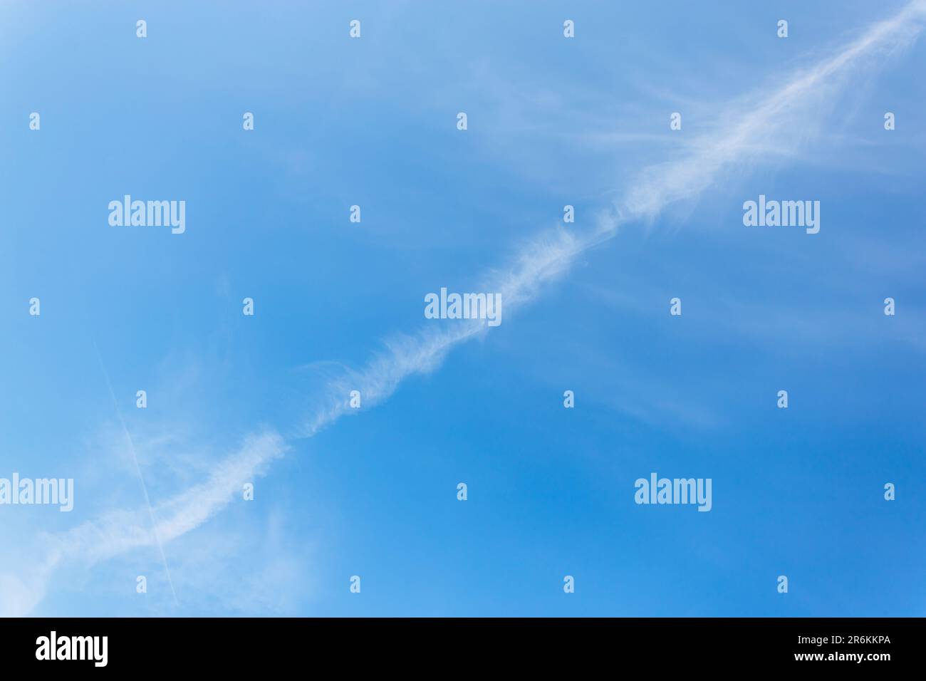 Trail line from a flying plane on a beautiful blue sky. Airplane trail ...
