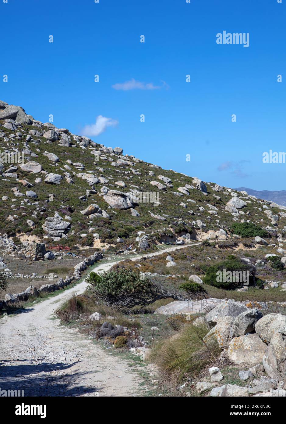 Rural path between granite volcanic rock. Volax village in Tinos island ...