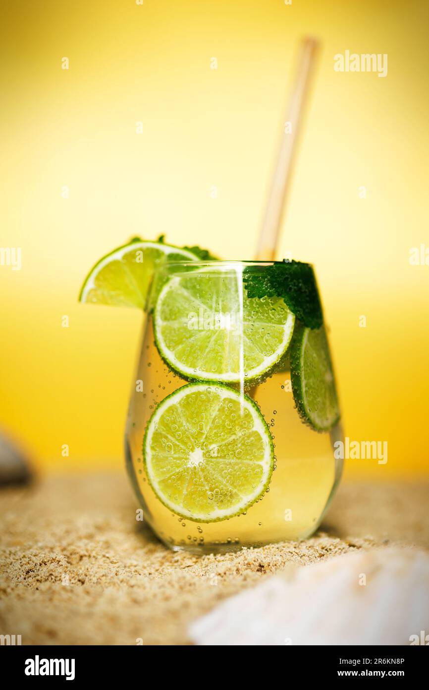 A glass of lemonade on the beach Stock Photo - Alamy