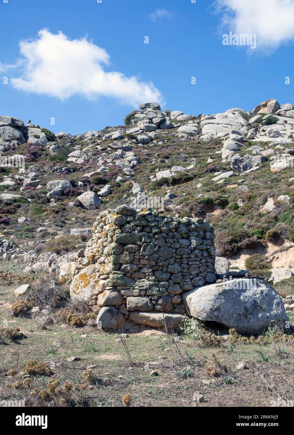 Stonewall structure between huge granite volcanic rock. Volax village ...
