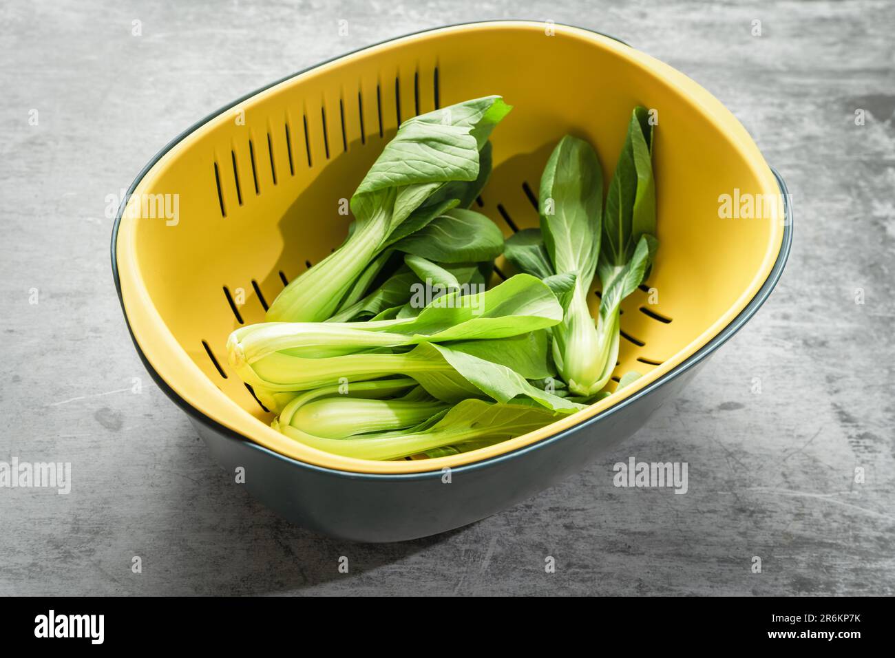 Shanghai green vegetables placed on a stone-patterned background board ...