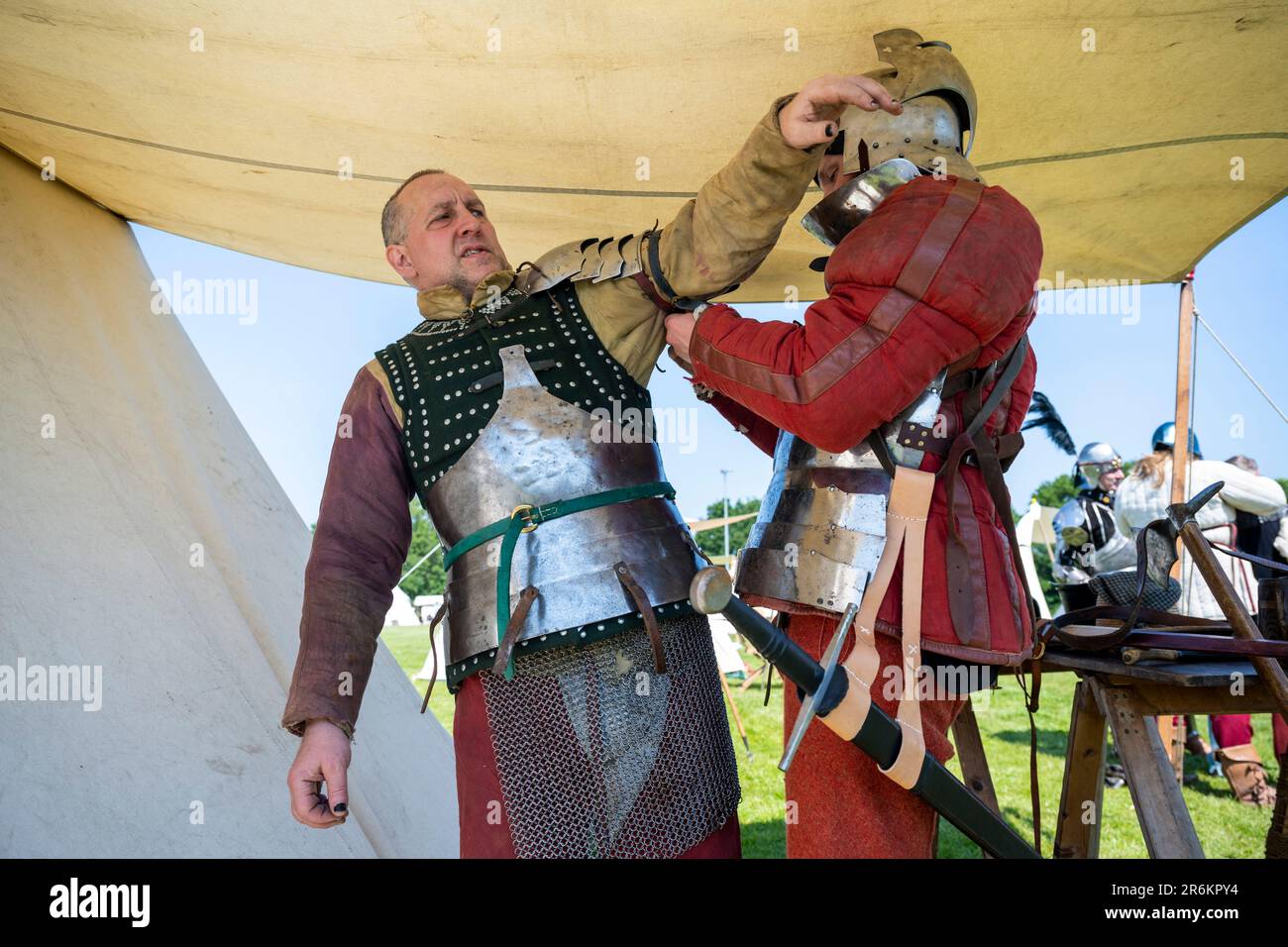 London, UK. 10 June 2023. Re-enactors don their armour during the ...