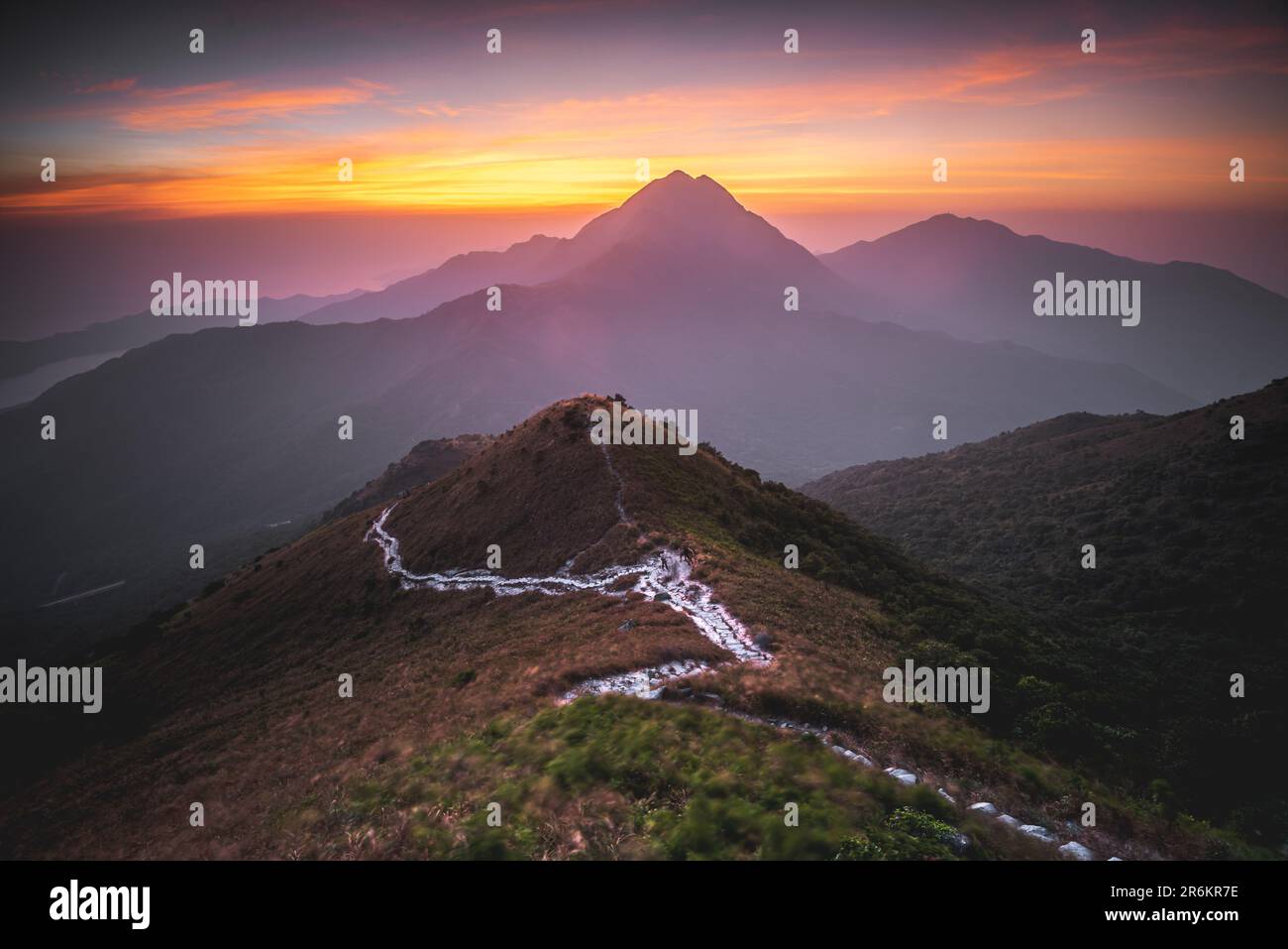 Sunset peak in Hong Kong during sunset with Lantau peak at background ...