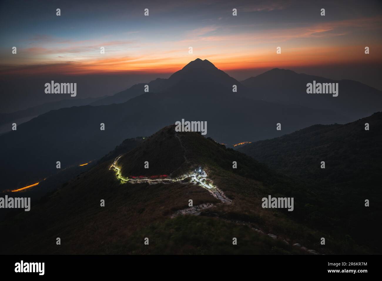 Sunset peak in Hong Kong during sunset with Lantau peak at background ...