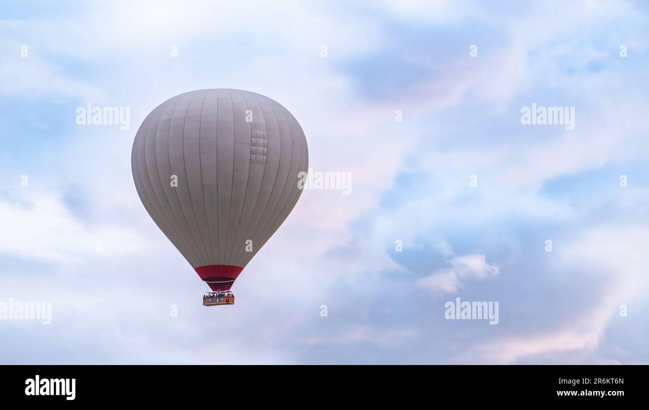 Cappadocia. Hot air balloons flying over Cappadocia in a dramatic sky ...