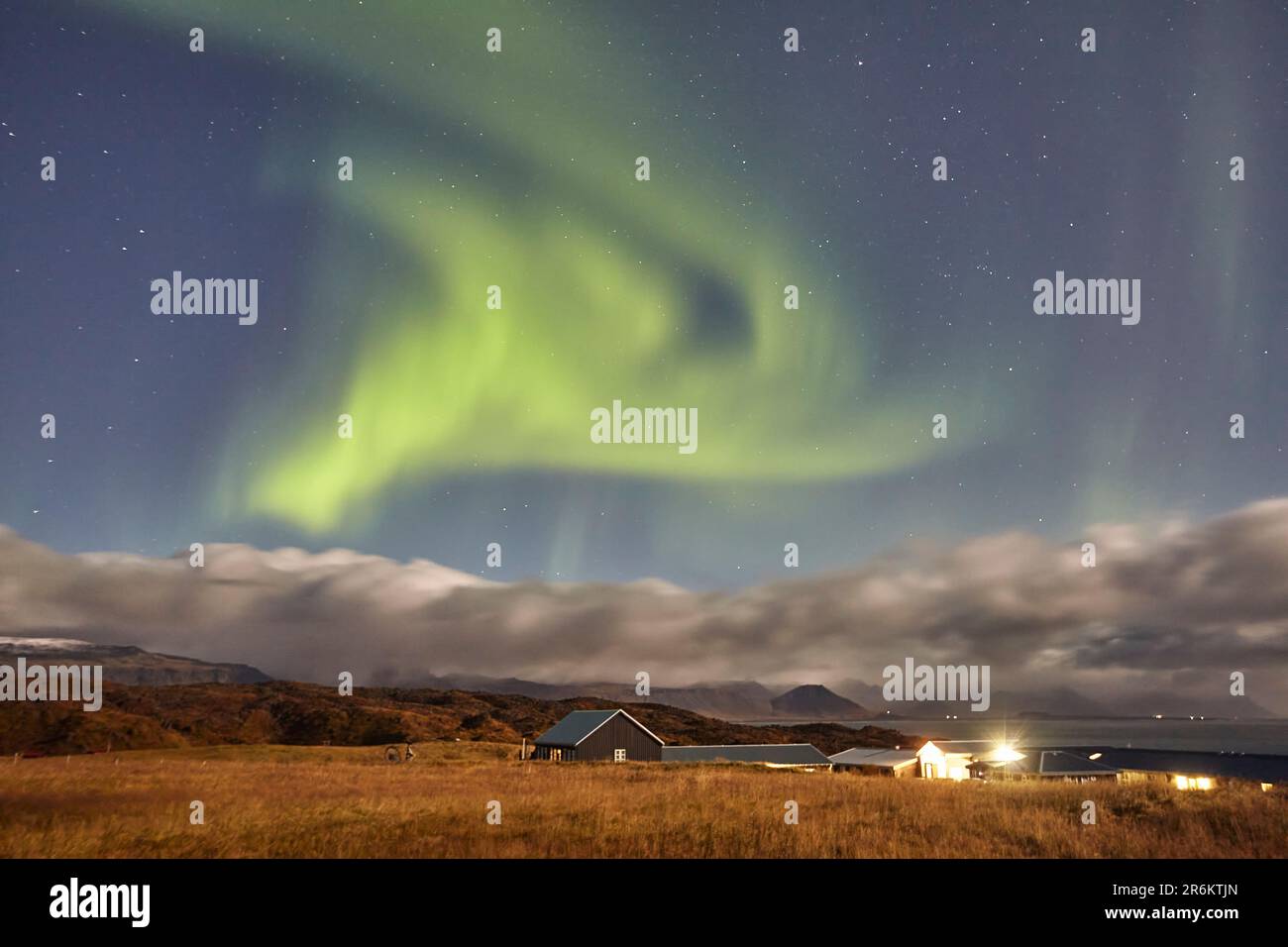 Northern Lights Aurora Borealis Over Countryside Around The Village