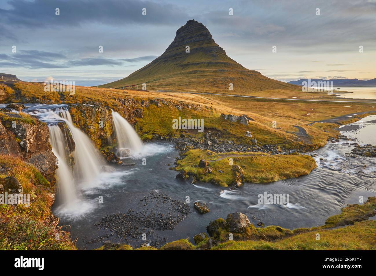 Mount Kirkjufell and Kirkjufellsfoss Falls, near the port of ...