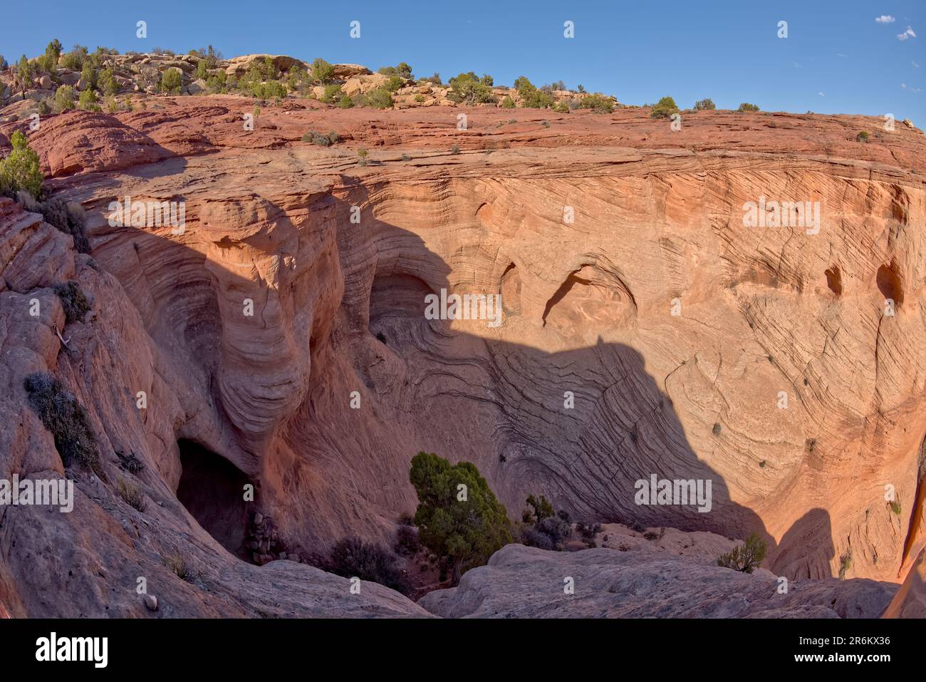 Caves in the cliff walls, used to store food by ancient Anasazi Indians ...