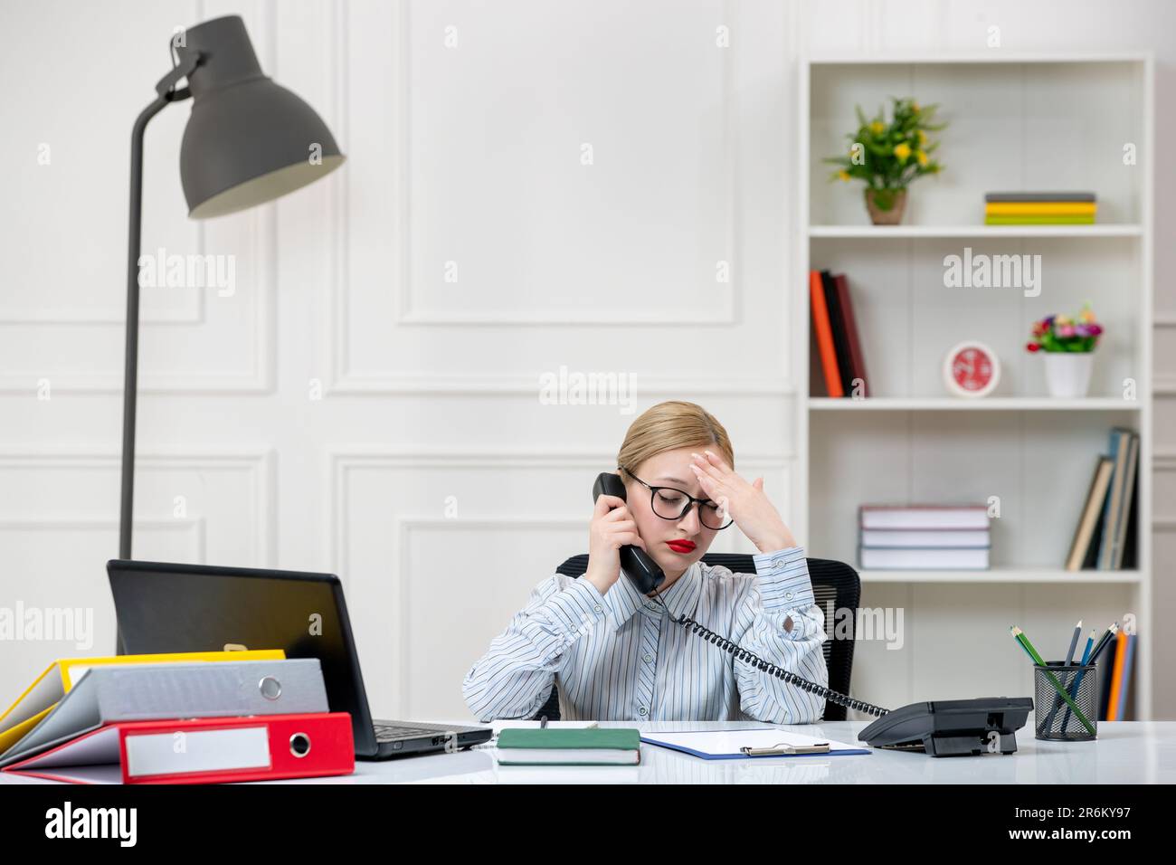secretary in office with work load cute lovely blonde young girl in ...