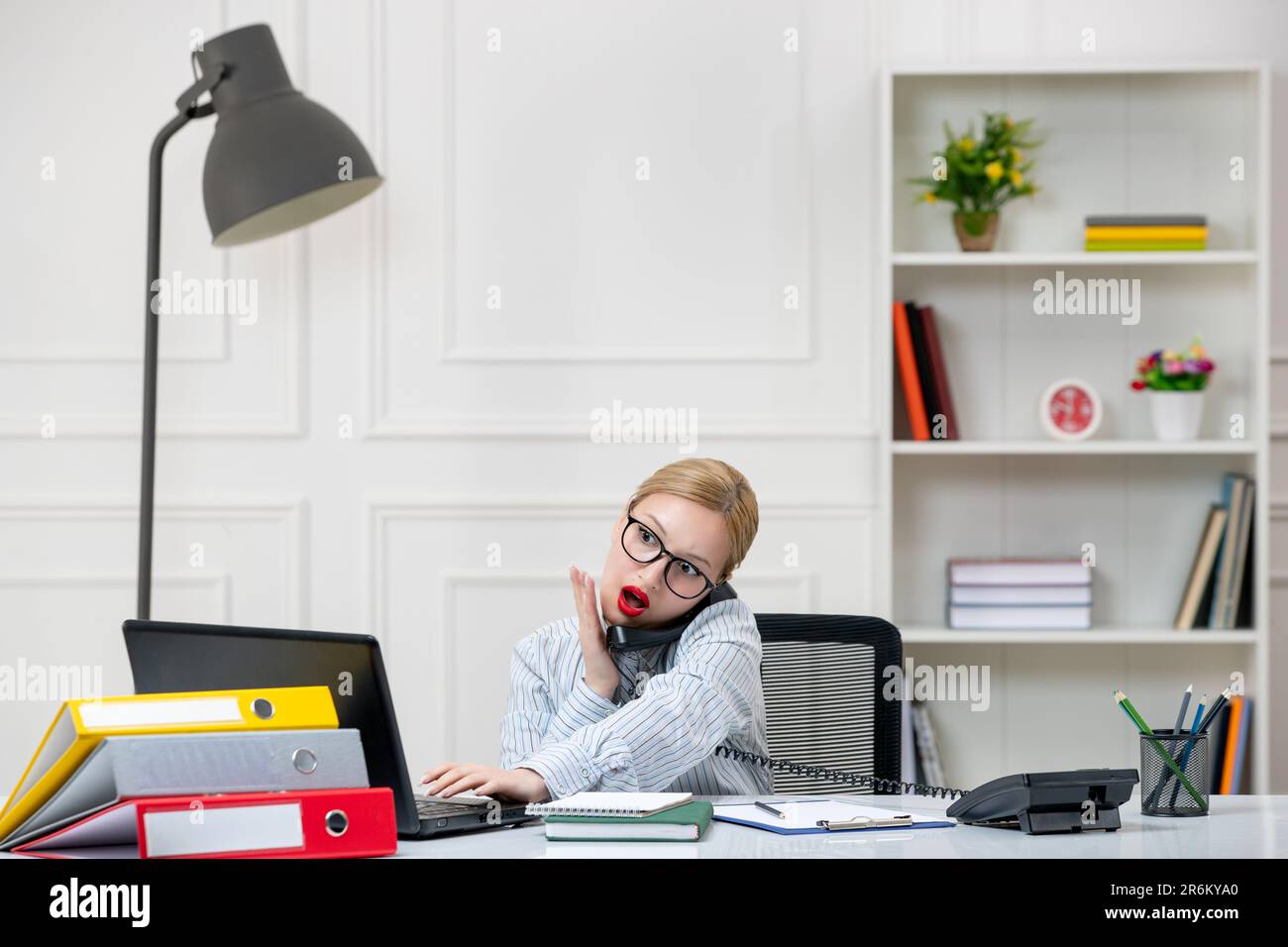 secretary in office with work load cute lovely blonde young girl in ...