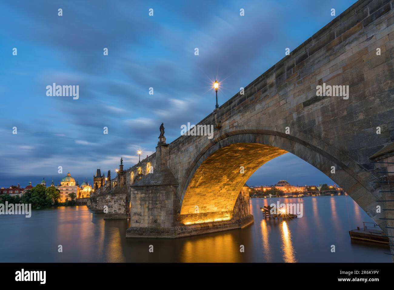 Illuminated arch of Charles Bridge at twilight, UNESCO World Heritage ...