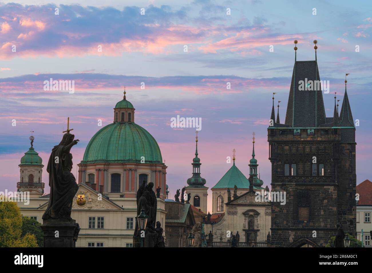 Details of statues and spires at Charles Bridge at sunrise, featuring ...